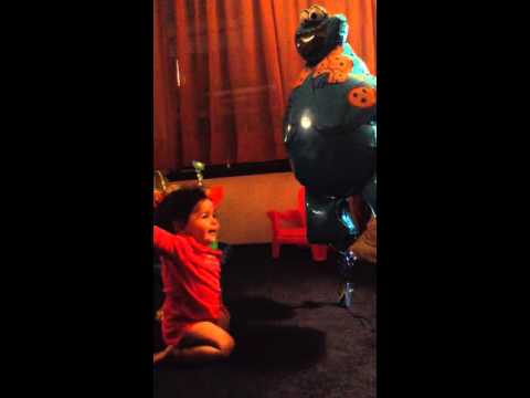 Playing with cookie monster balloon