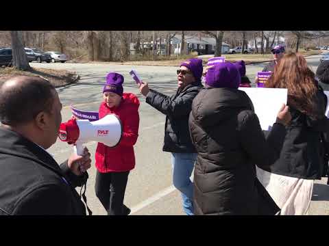 Workers picket the Blue Hills Health and Rehabilitation Center in Stoughton