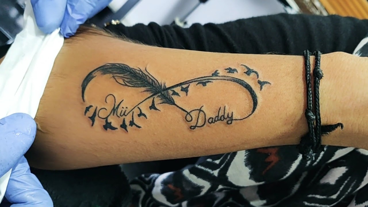 (Alpha Tattoos) Infinity with feather and Dad tattoo