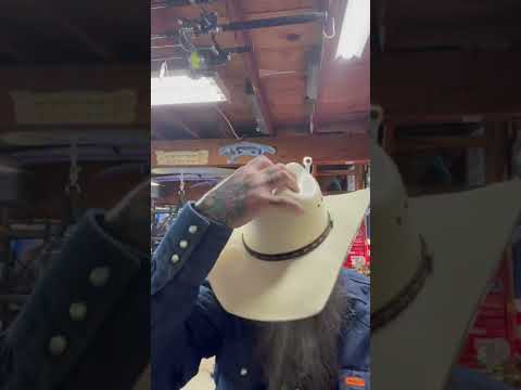 Annual changing of the Stetson Cowboy Hat for summer.