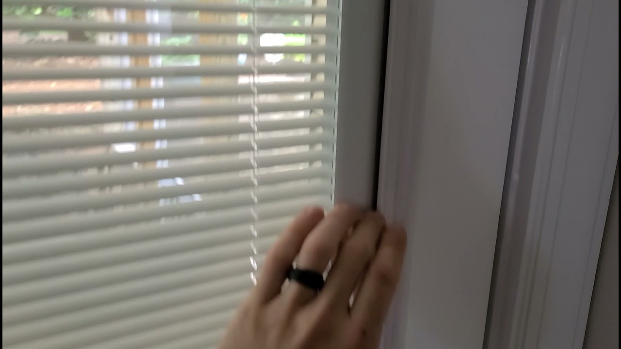 Fixing built-in blinds on a client's glass door