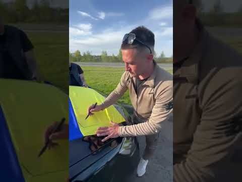 Roman Hrybov, Snake Island Survivor, Signs a Flag for Ukraine Focus