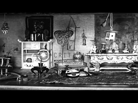 'Mother' Katherine Larke, a world-war worker, arranges tiny objects in her three-...HD Stock Footage