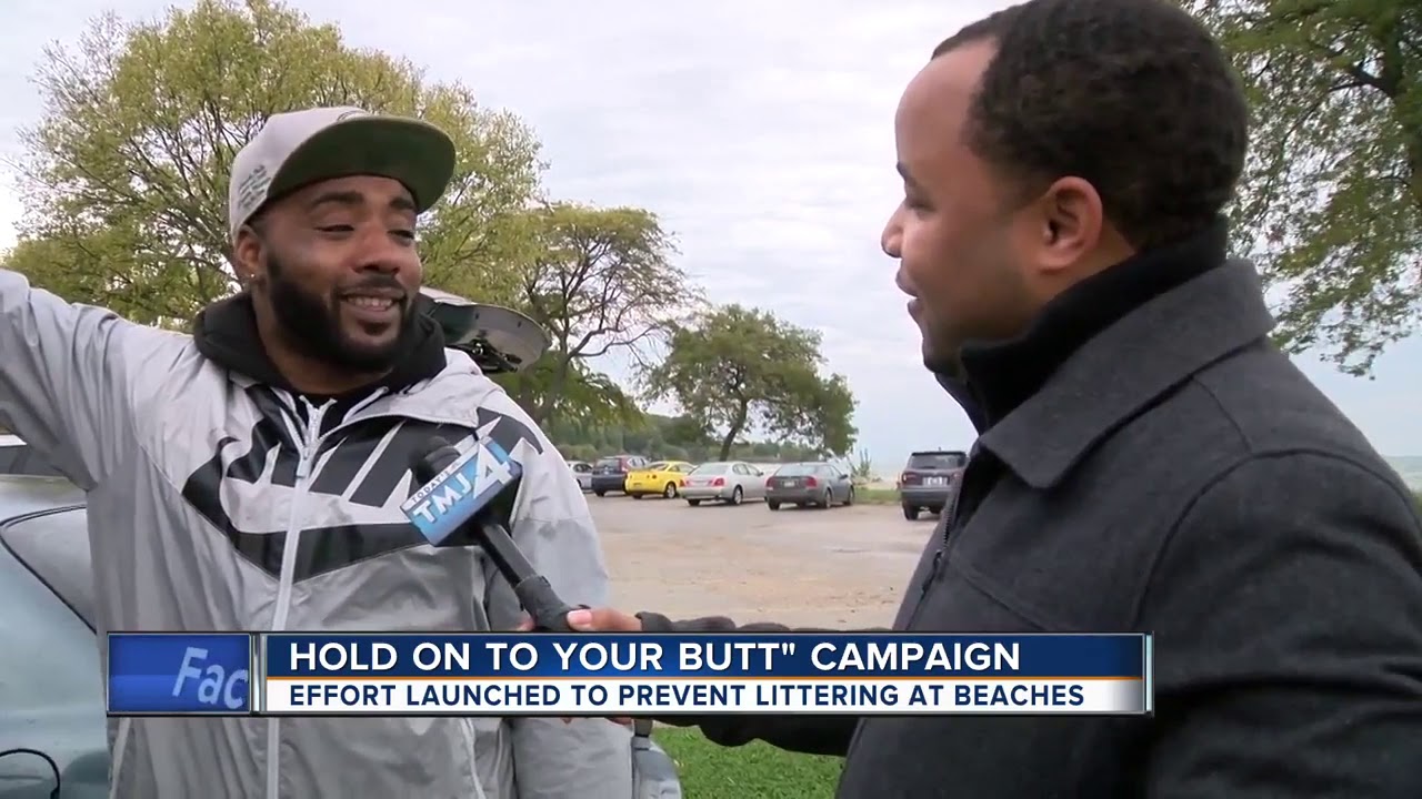 Volunteers pick up cigarette butts along Lake Michigan