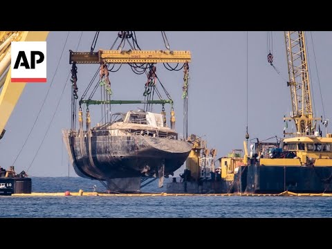 Luxury superyacht is partially resurfaced 10 months after sinking off Sicily
