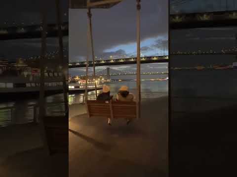 Pier 35 view of the Manhattan and Brooklyn Bridges at dusk