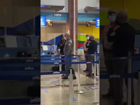 SDQ Santo Domingo Airport. Man gets arrested/fights for trying to board flight without a covid test.