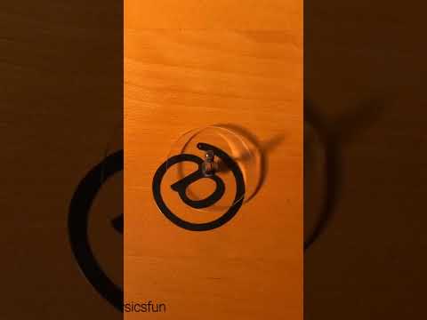 A spin top kinetic art toy | which takes advantage of Newton’s 3rd law and rotational kinetic energy
