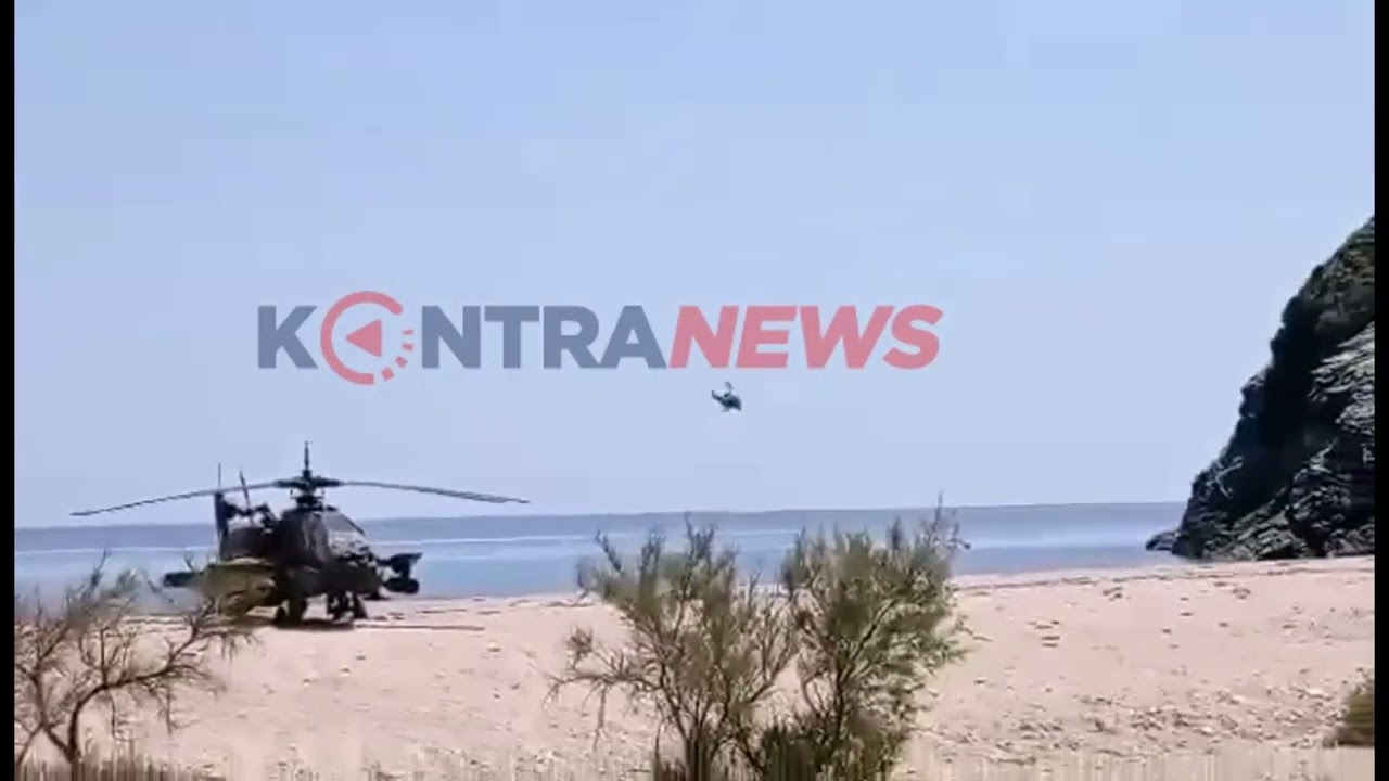 Καθηλωμένο στην άμμο σε παραλία της Καρύστου στρατιωτικό ελικόπτερο ...