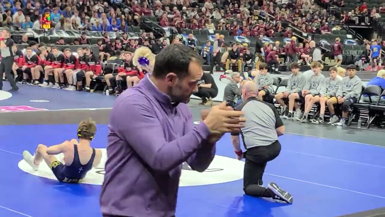 Tegan Krall gets a pin for New Ulm.