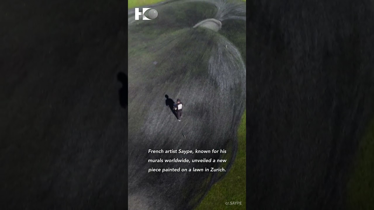 Giant artwork by Saype painted on lawn