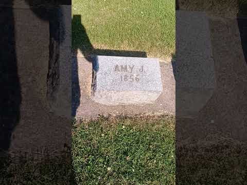 6 family members gravestones in a family burial plot in a row in cemetery
