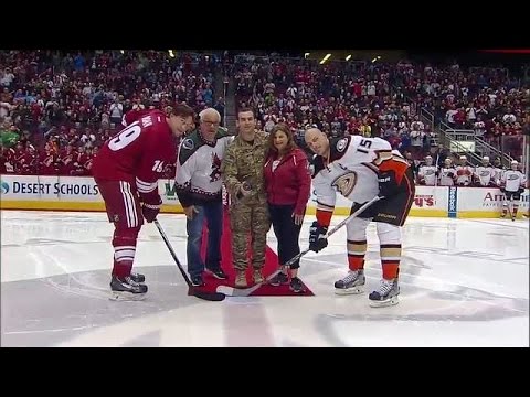 Couple gets unexpected surprise during hockey puck drop (VIDEO ...