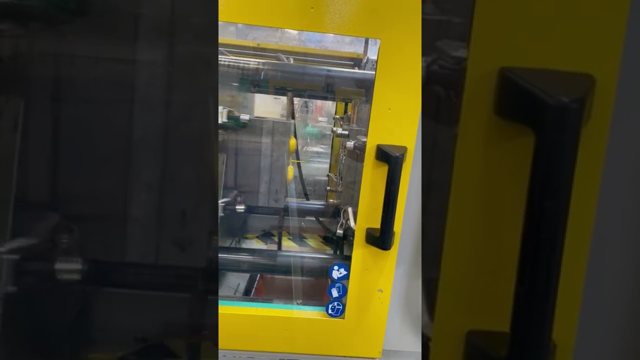 Plastic Injection Moulding Machine in action - Dudley Associates Ltd