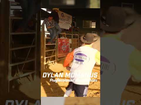 Bullfighter jumps over bull rider