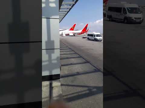 Luanda International Airport. Taag Angola airline Boeing 737 and 777 at gate.
