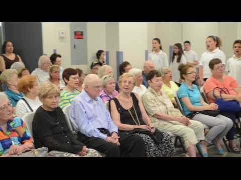 PS 100 sings for Trump Village seniors