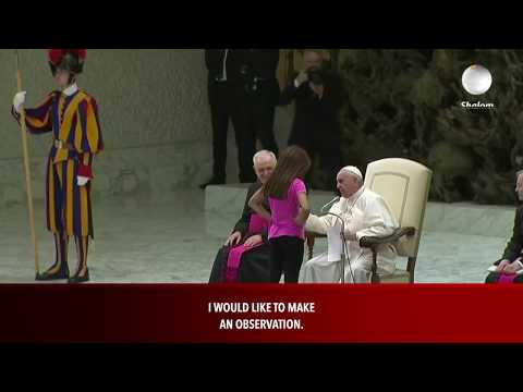 Smiling Pope Francis allows a little girl to run free on stage