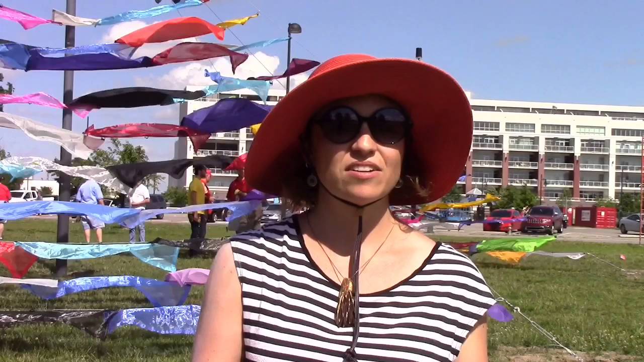 Volunteers install Riverfest artwork