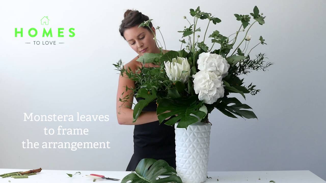 How to arrange flowers in a tall vase