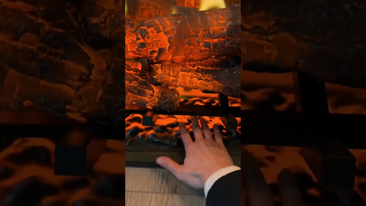 Demonstrating my new electric fireplace. Looks SO REAL even up close. Dimplex Revillusion (RBF30-GP)