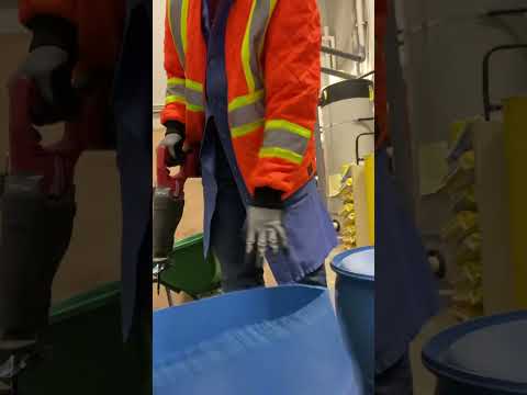 cutting the plastic drum in half, for organic waste