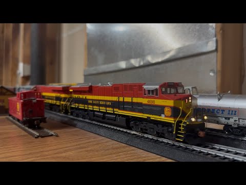 KCS M263 with a Grey Ghost GP40-2 trailing on the layout.