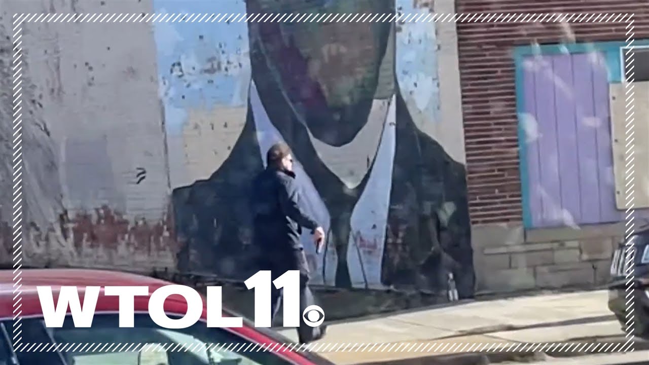 Toledo police release bodycam showing arrest of man allegedly waving a gun after car crash