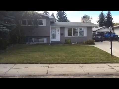 Power pole narrowly misses house for sale in Saskatoon!