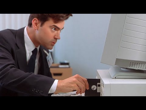 Planting the virus and checking the bank account balance – Office Space (1999)