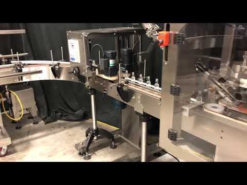 Complete Line Bottle Unscramble, Filler, Capper and Labeler by Acasi Machinery