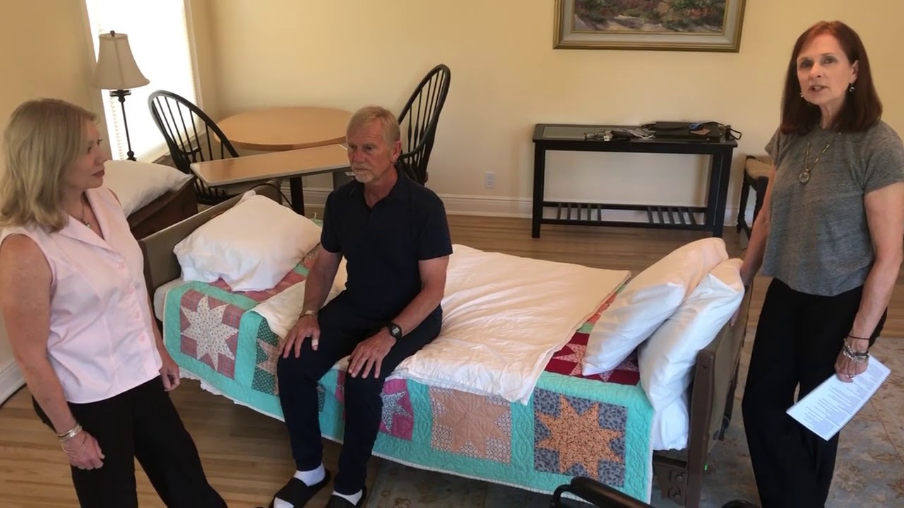 Transfer a patient from bed into a wheelchair with 1-person assist.