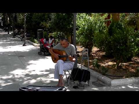 Musician in the park of Rhonda (Spain) (HD)