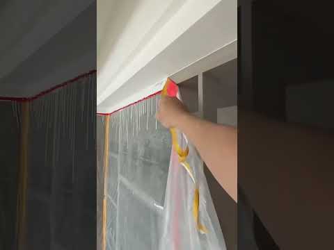 The painter is tearing off the tape