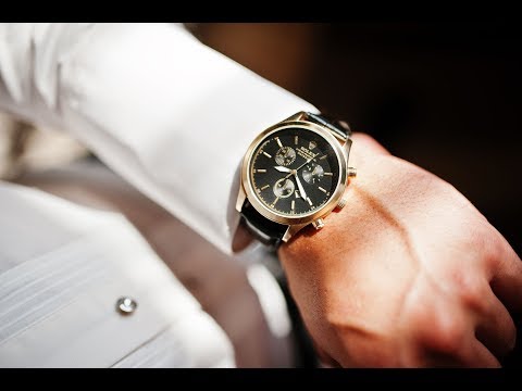 Is it okay for a man to wear a watch on Shabbos where there is no eruv?