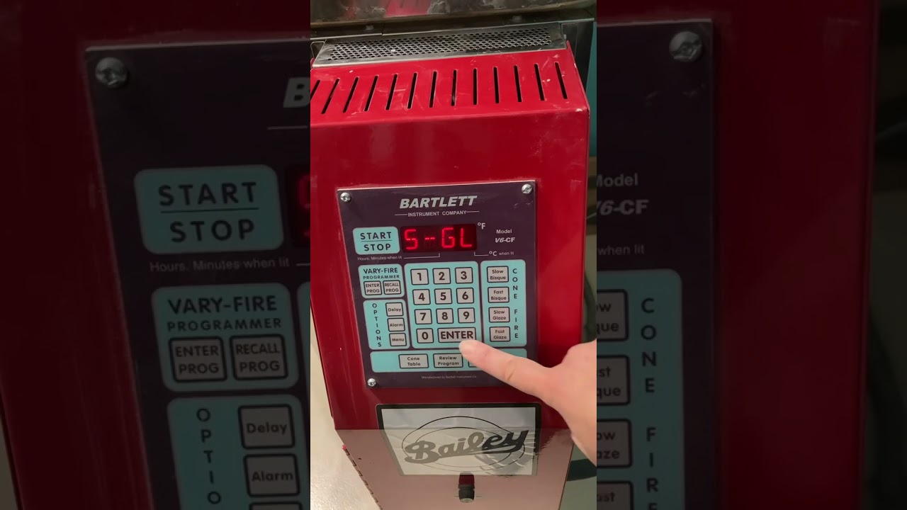 Programming the kiln for cone 6 firing (set it to cone 5).