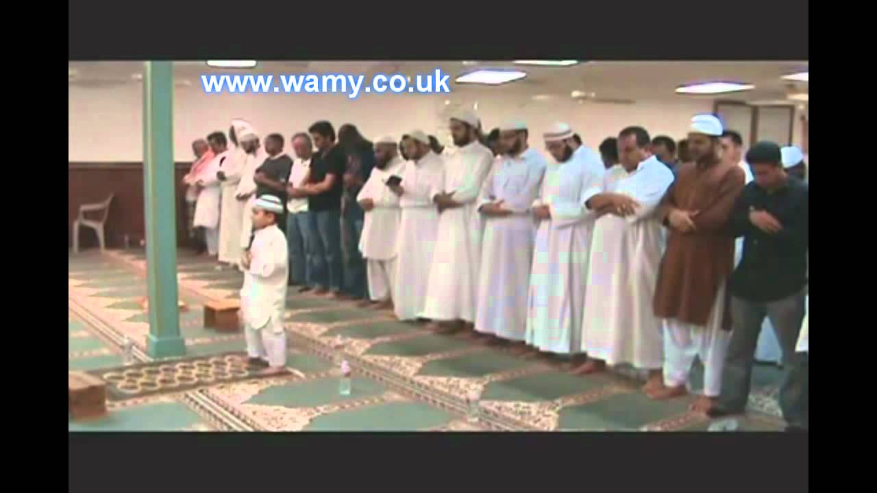 Must see it Masha'allah....Young boy leads the Prayers.