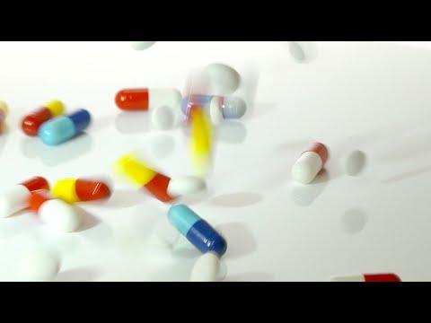 Pills and Tablets Medication Falling on a White Surface - Free Stock Video Download - Free Footage