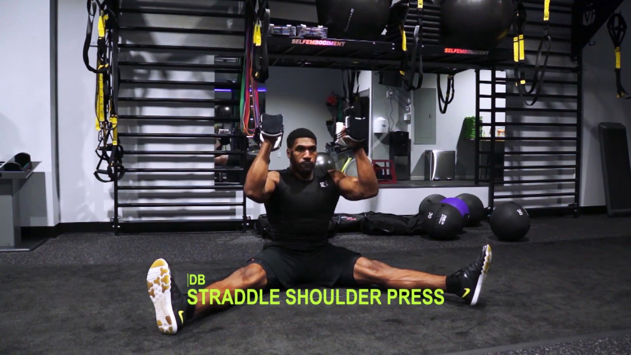 Dumbbell Straddle Shoulder Press
