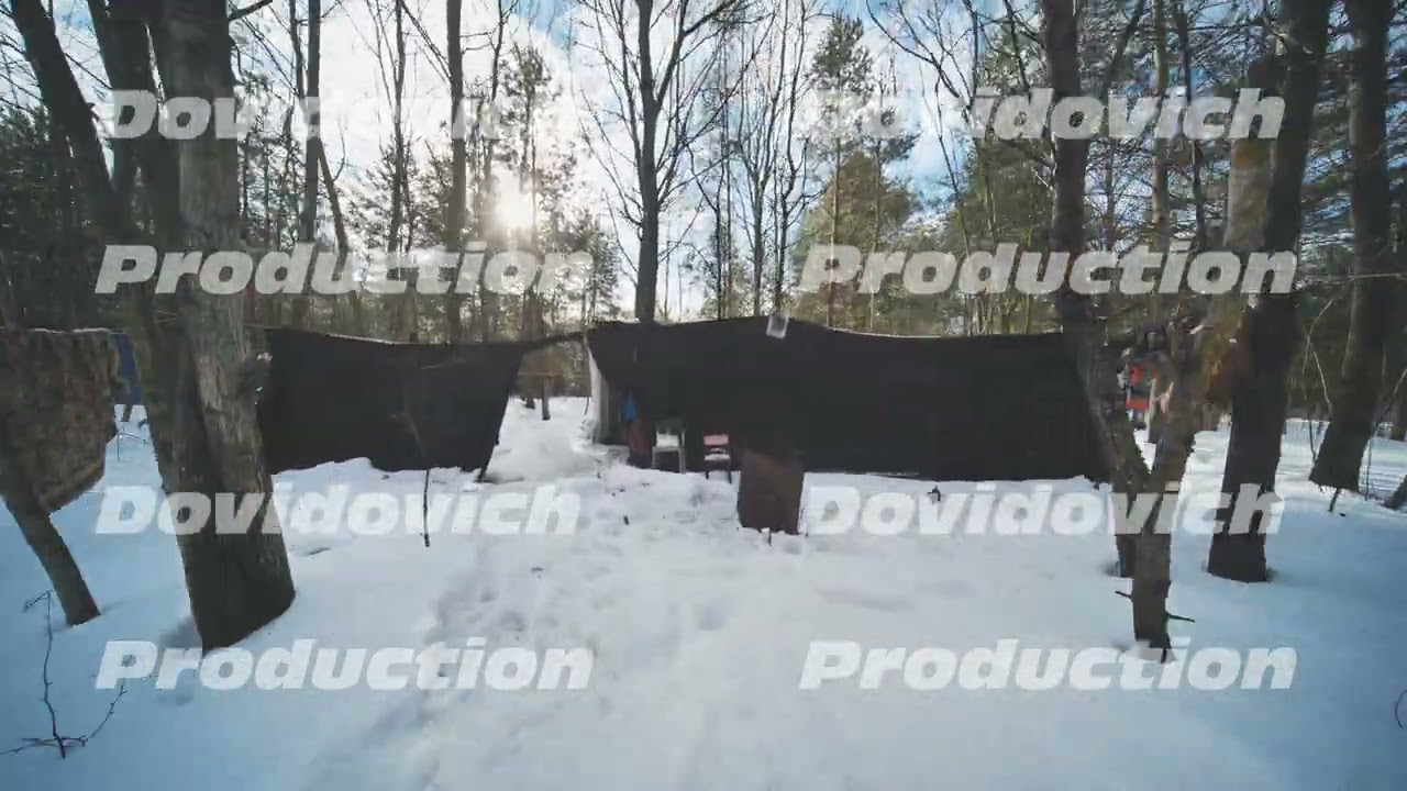 A hut of homeless people in the woods in winter.