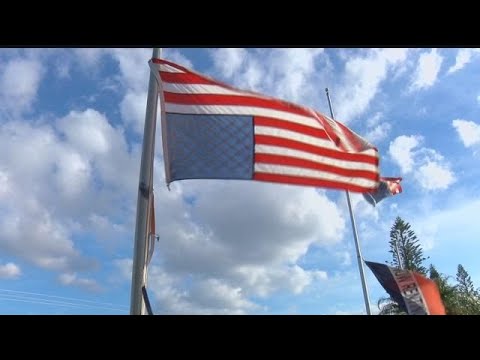 American flags flying upside down at Cape complex