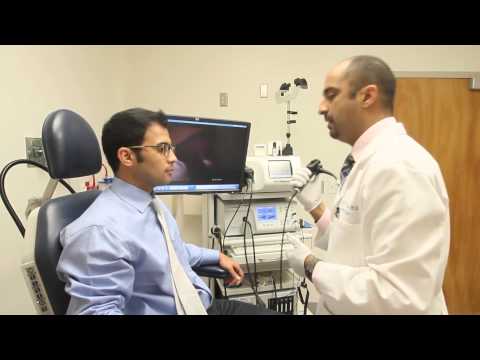 Laryngoscopy and stroboscope to examine the vocal cords