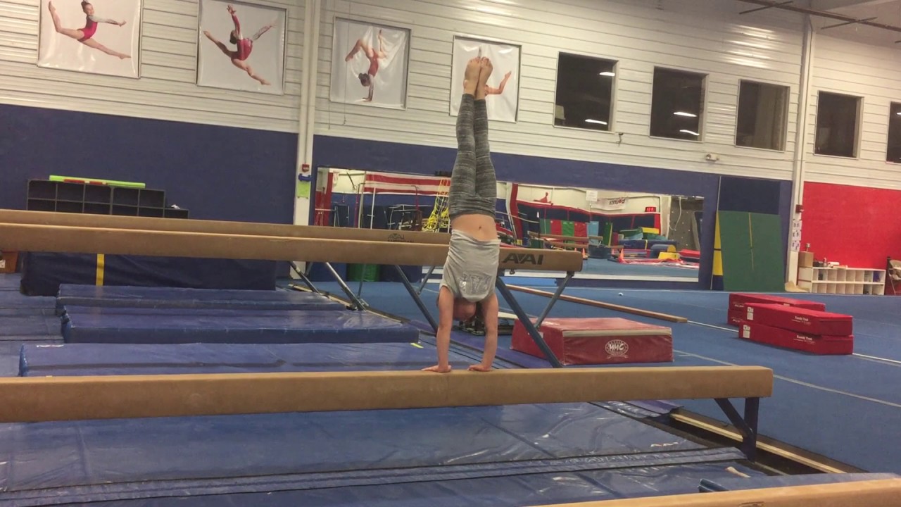 Handstand turn dismount beam