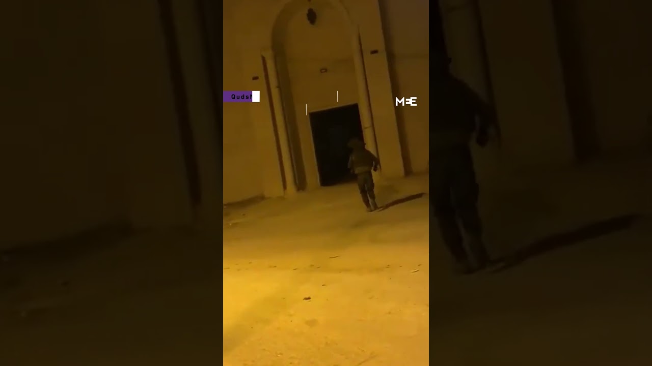 An Israeli soldier throws a stun grenade into West Bank mosque during call to prayer