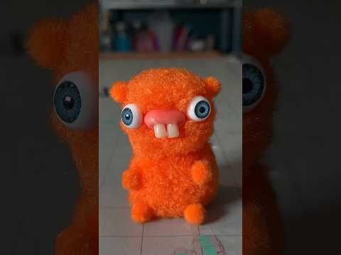 Making a weird creature out of Pom poms and hot glue