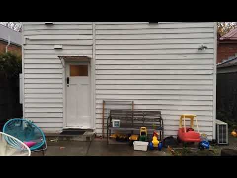 Structural Alterations Aluminium Stacker Door installed into a weatherboard home in Fitzroy