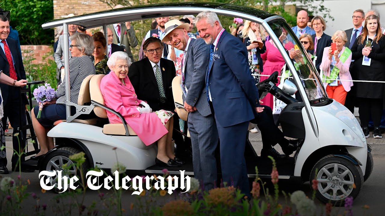 The Queen tours Chelsea Flower Show in her very own chauffeur-driven buggy