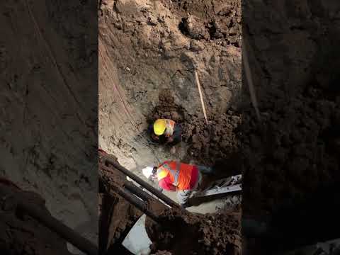 Construction workers in Canada doing sewerage connections