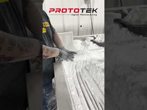 Digging through Nylon 12 after SLS 3D Printing Parts at Prototek