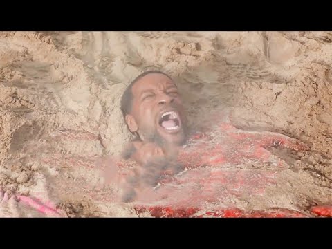 The father was buried in the sand and instantly struck by lightning.